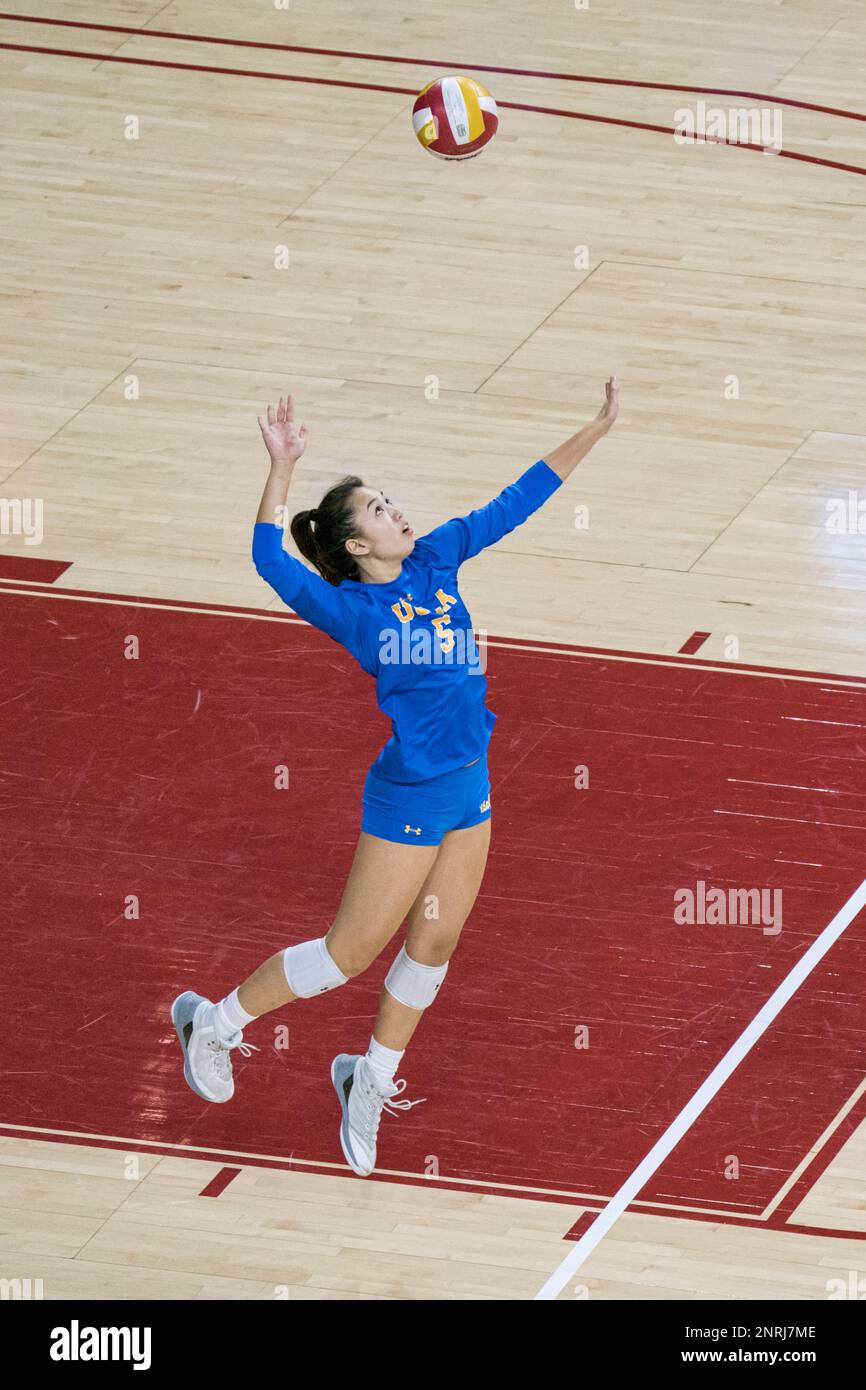 UCLA Bruins setter Devon Chang (5) serves against the Southern ...