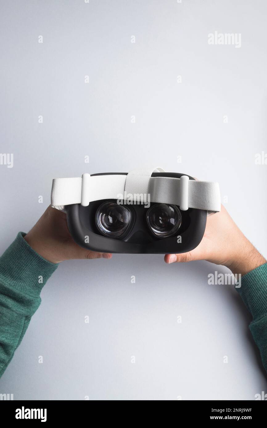 Hands with virtual reality goggles on white background, augmented ...