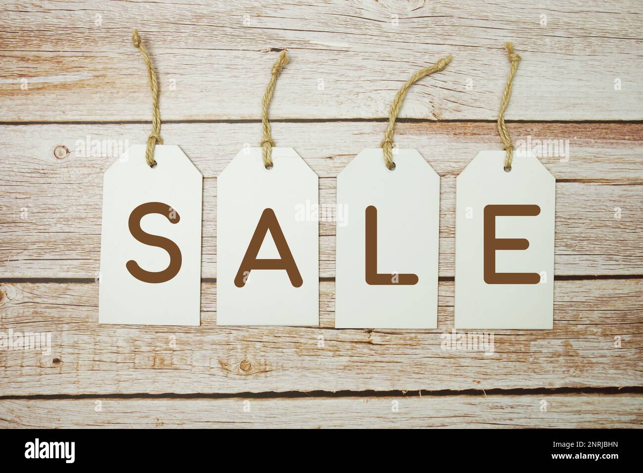 White Tags With SALE alphabet letters on wooden background Stock Photo ...