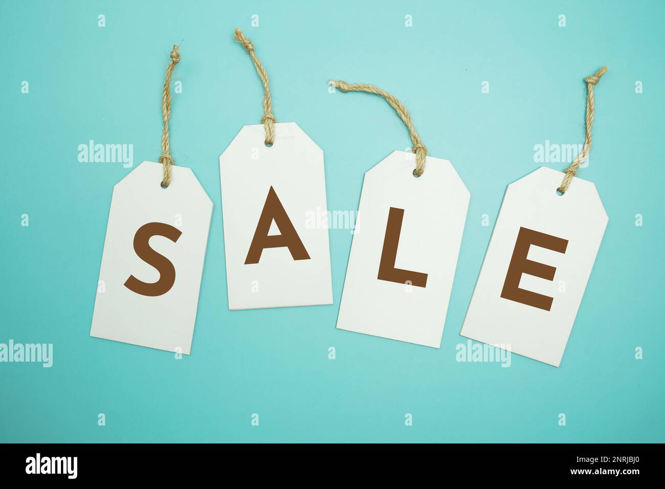 White Tags With SALE alphabet letters on blue background Stock Photo ...