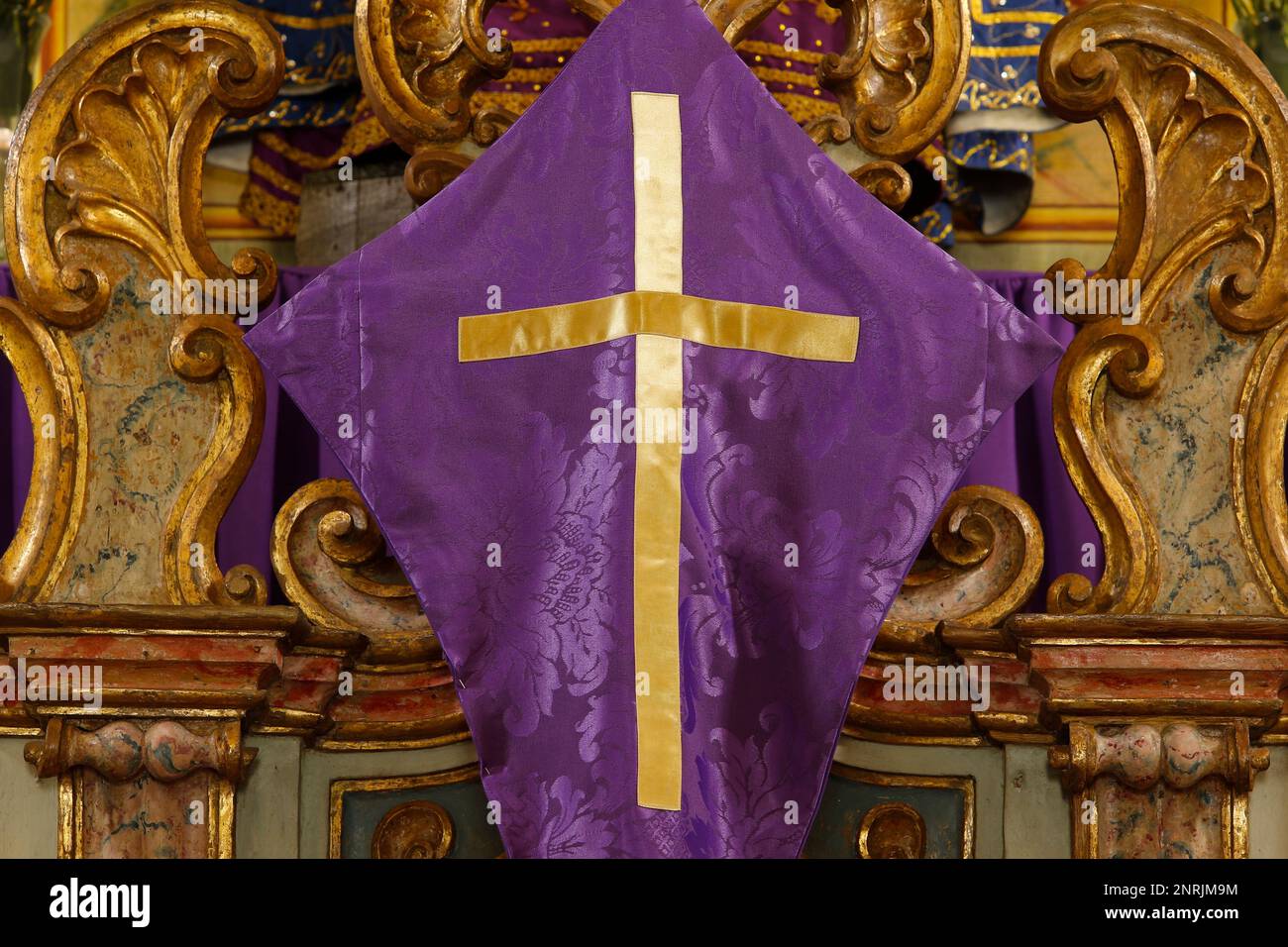 Lent and Holy Week - sacred image covered with purple fabric and symbol ...