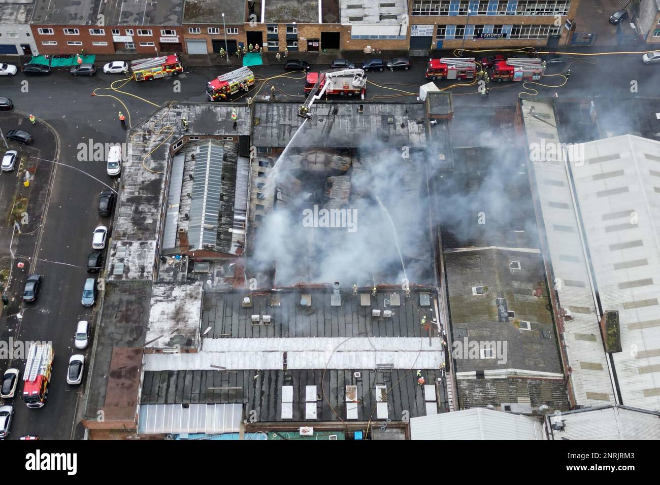 Firefighters at the scene of a two-storey warehouse fire in the Hockley area of Birmingham where ...