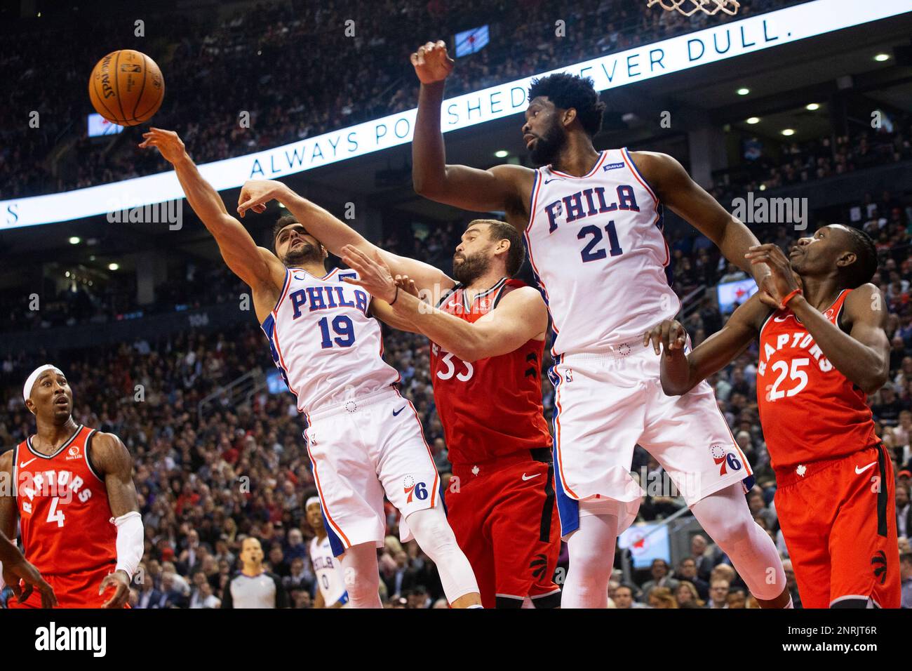 Philadelphia 76ers guard Raul Neto (19) jumps for a rebound ahead of ...