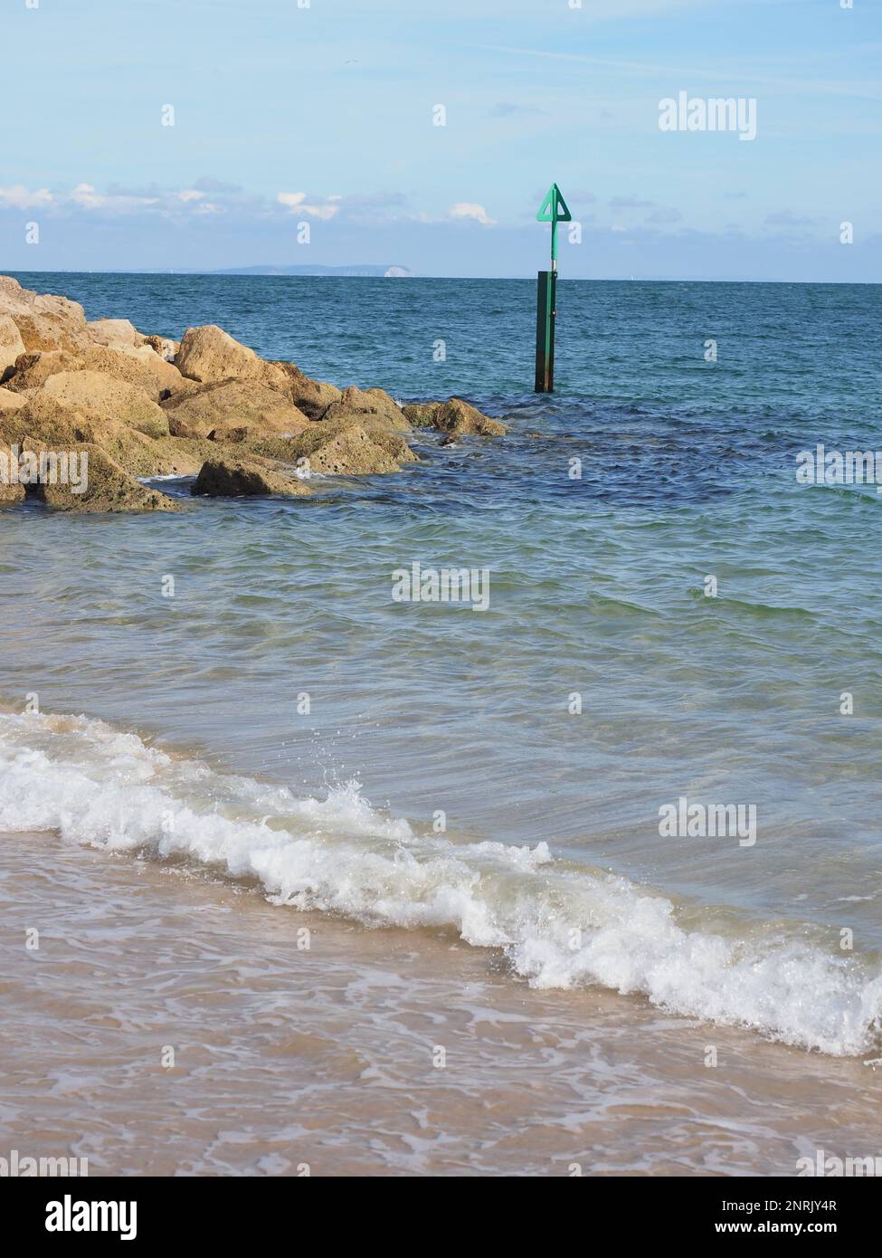 Portrait format picture of shoreline near sandbanks in Poole with the ...