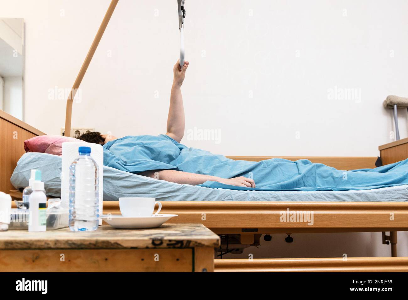 homecare adjustable electric hospital bed with sick person holding ...