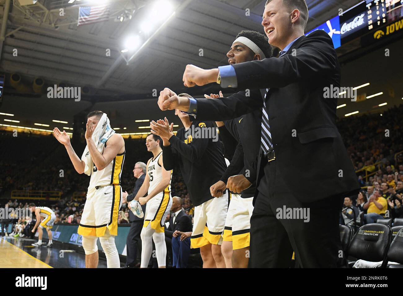 IOWA CITY, IA. - NOVEMBER 24: Iowa players on the bench react to a ...