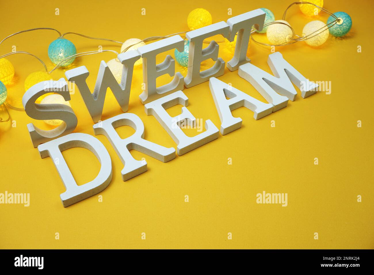 Sweet Dream alphabet letter with LED cotton balls on yellow background ...