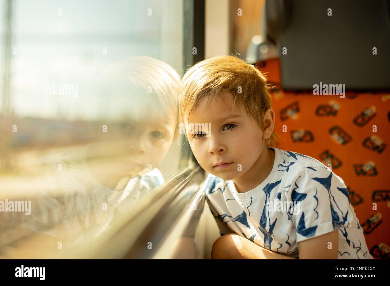 Cute little child, boy, traveling on a train, summertime Stock Photo ...