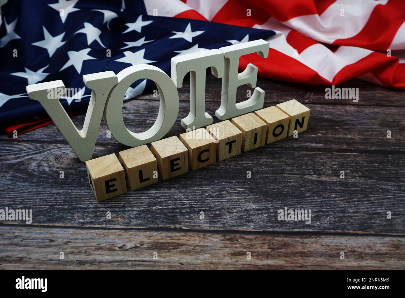 Vote Election Word alphabet letters with USA flag on wooden background ...