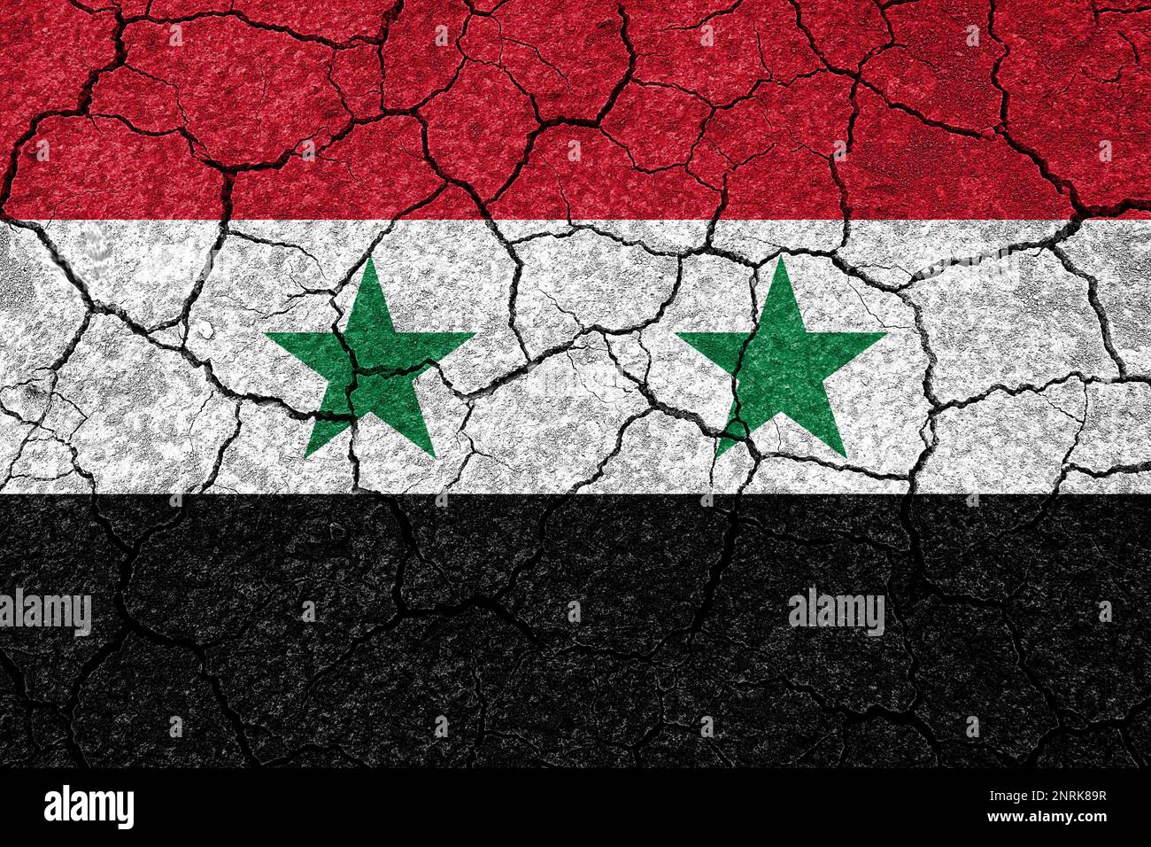 Earthquakes in Syria, flag Syria on a wall with cracks from an ...