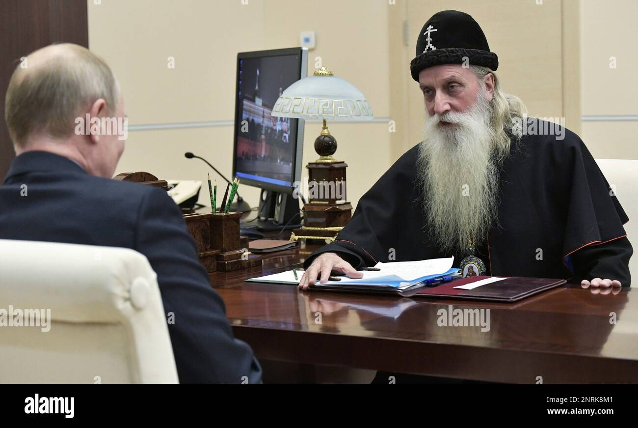 Russian President Vladimir Putin, left, listens to Russian Orthodox Old ...