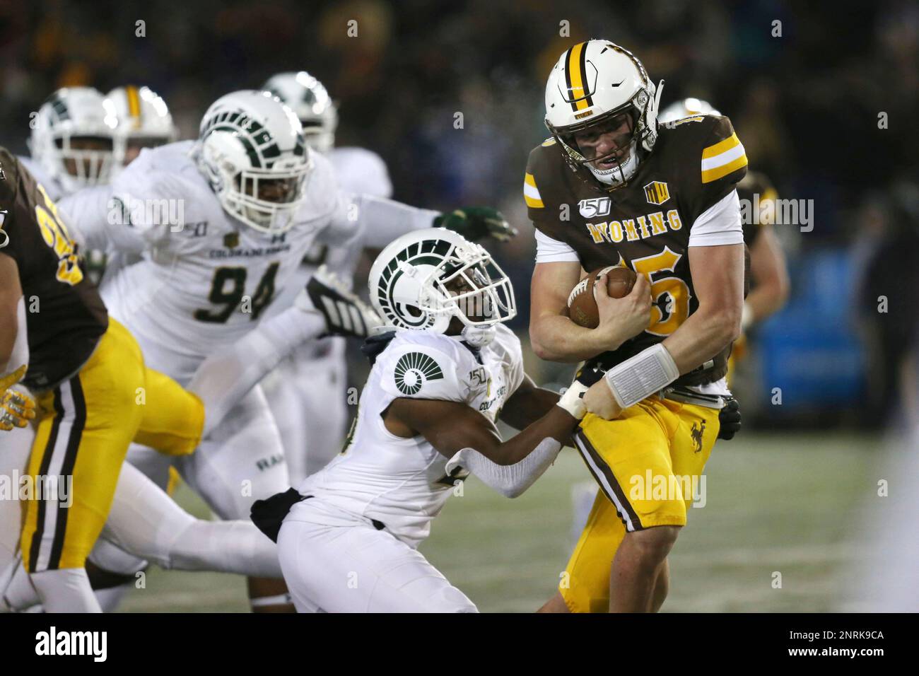 Wyoming quarterback Levi Williams (15) pushes through Colorado State ...