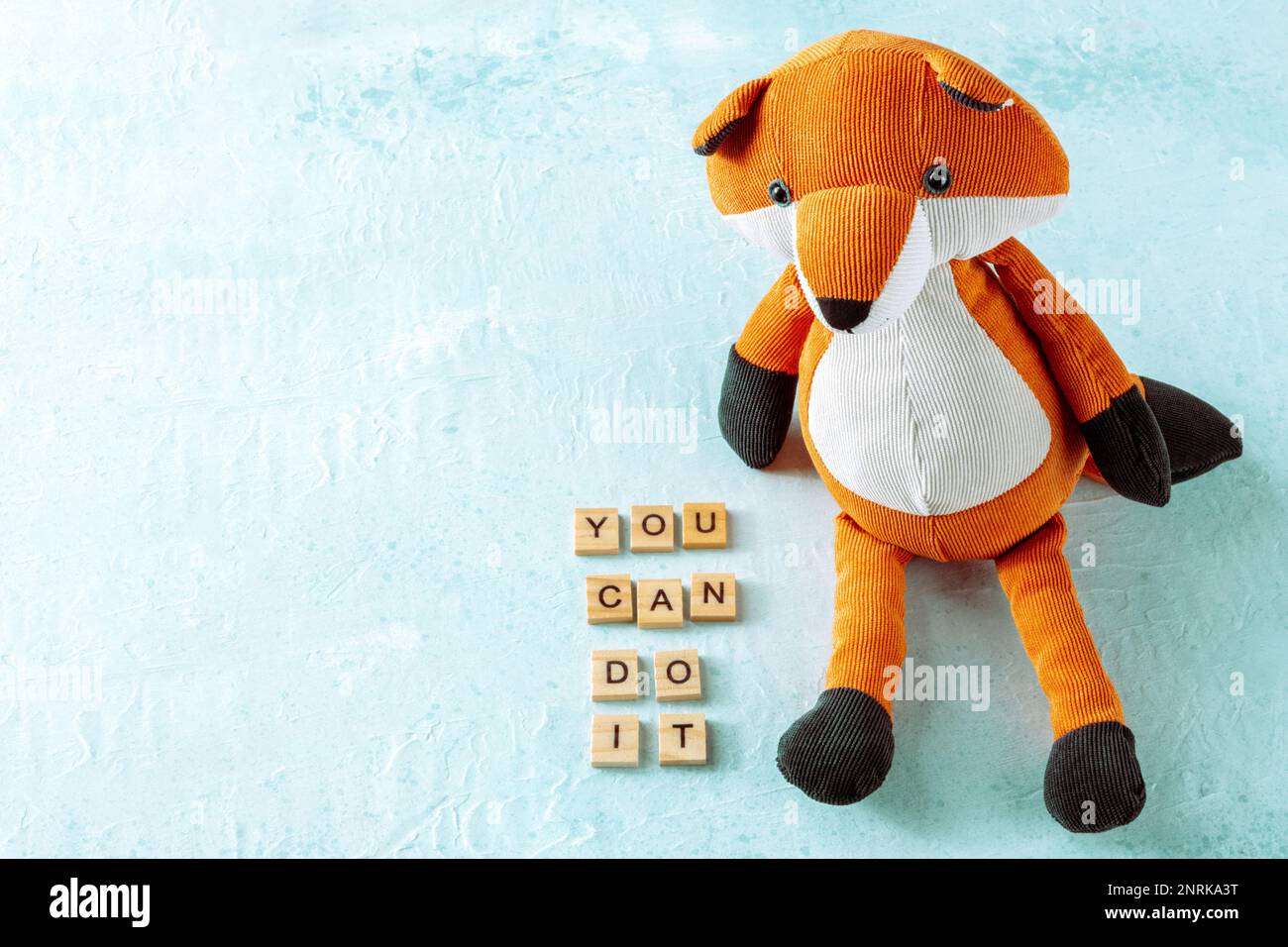 You can do it, motivational banner with a toy fox on a blue background ...