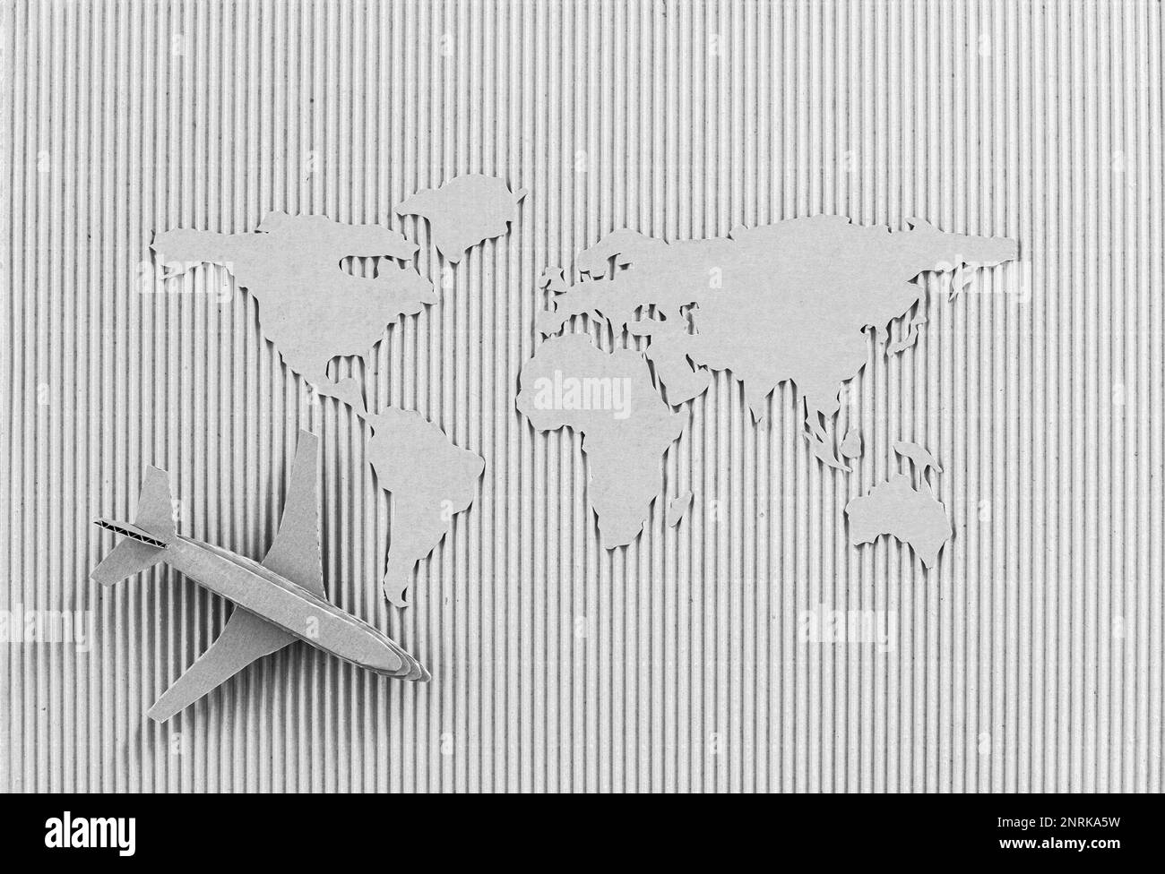 Airplane and world map made of cardboard Stock Photo - Alamy