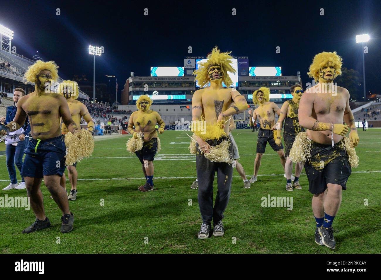ATLANTA, GA – NOVEMBER 21: Georgia Tech fans dance on the field ...