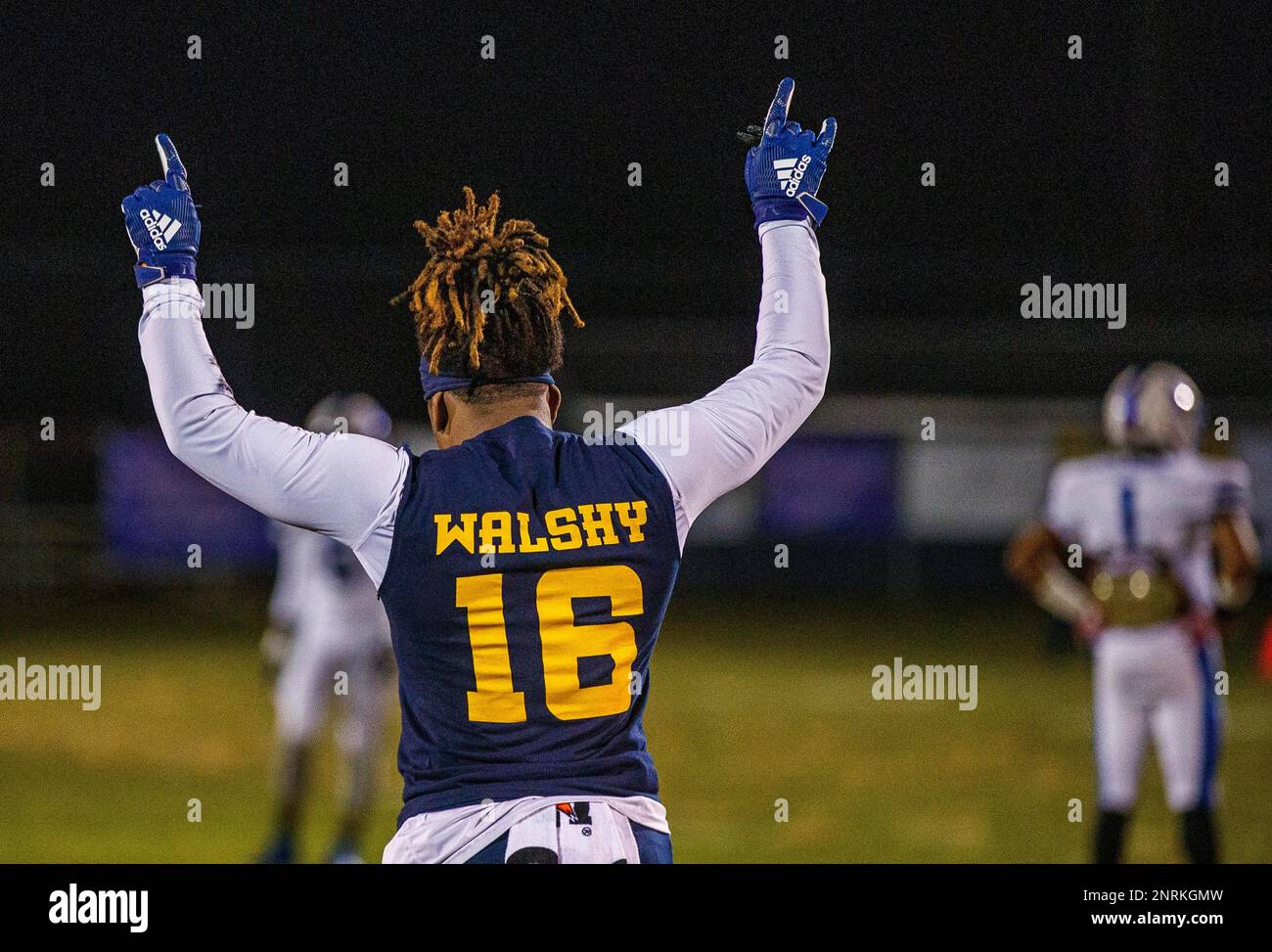 Holy Spirit's Elijah Gray points to the sky while wearing #16 for long ...