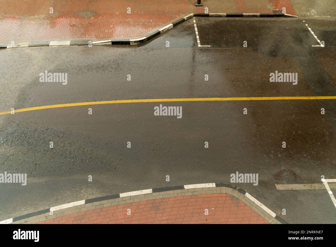 rain water soaked city road and sidewalk. raining in the city Stock ...