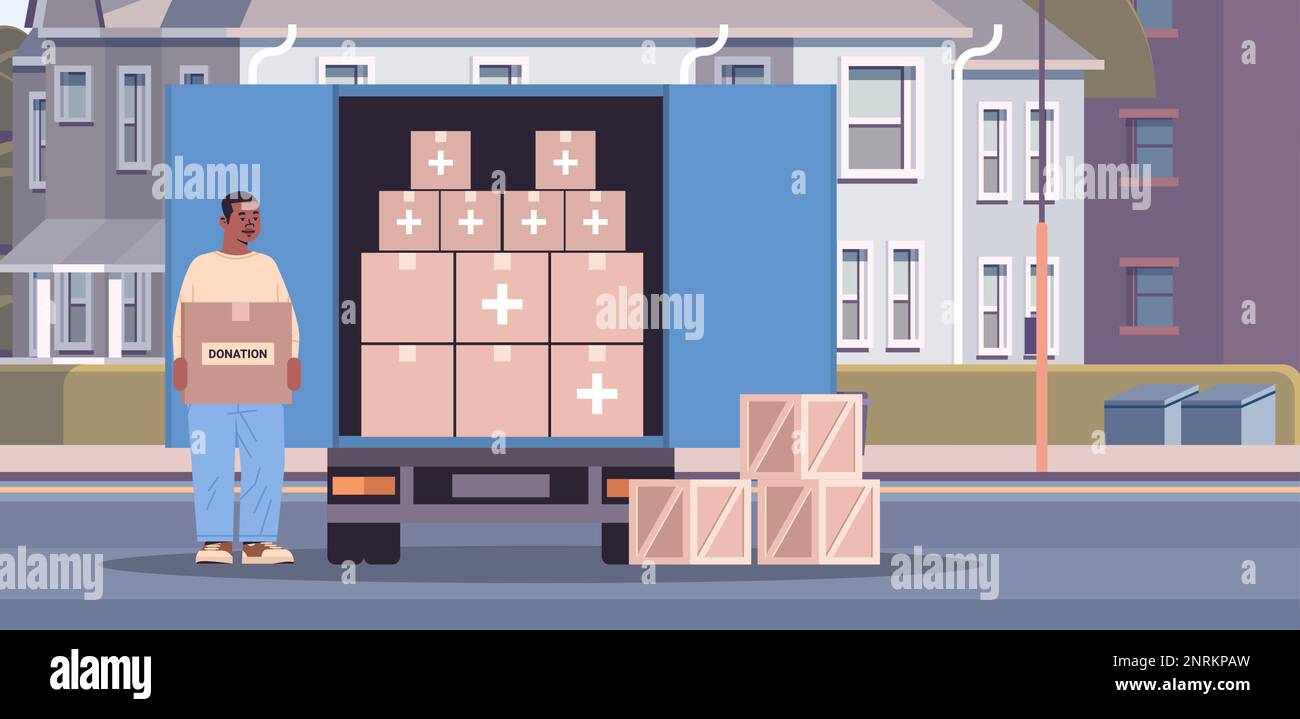 young man loading donation help box with medical supplies humanitarian ...