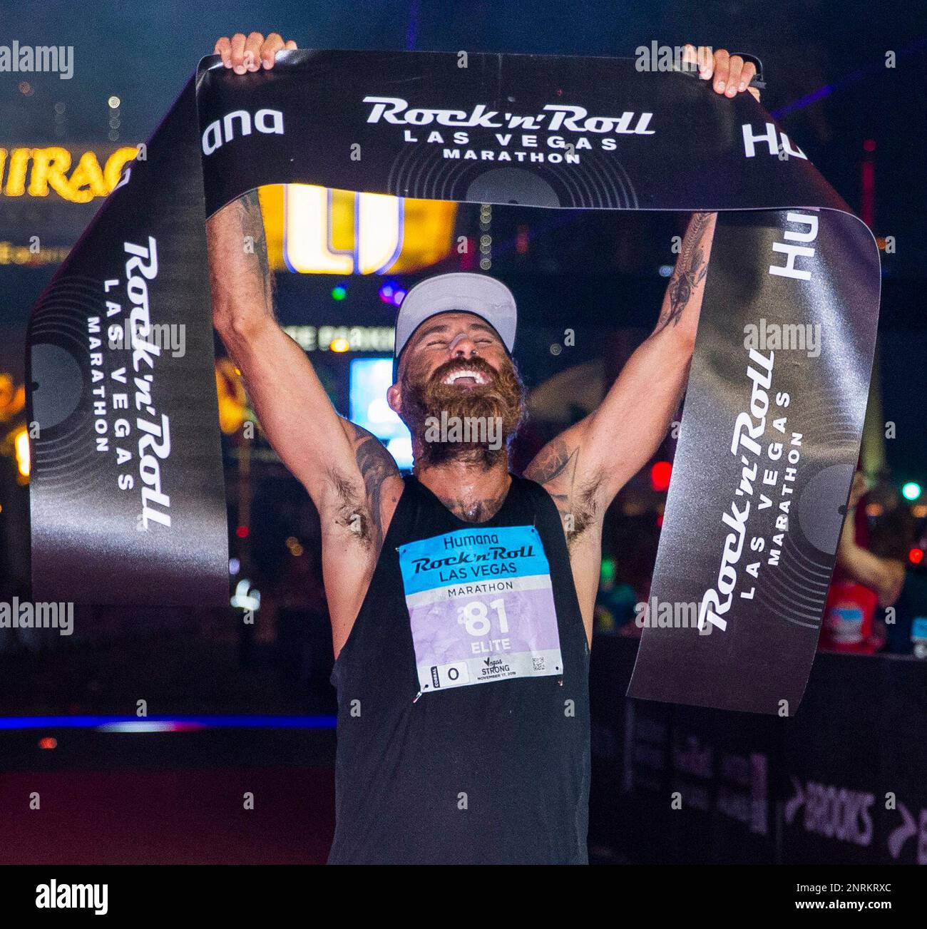 Men's marathon winner Tommy Puzey celebrates at the finish line during ...