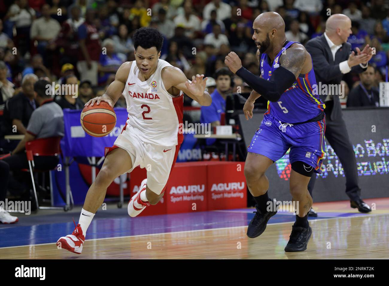 CARACAS, VENEZUELA - FEBRUARY 26: Trae Bell-Haynes of Canada drives the ball against Gregory ...