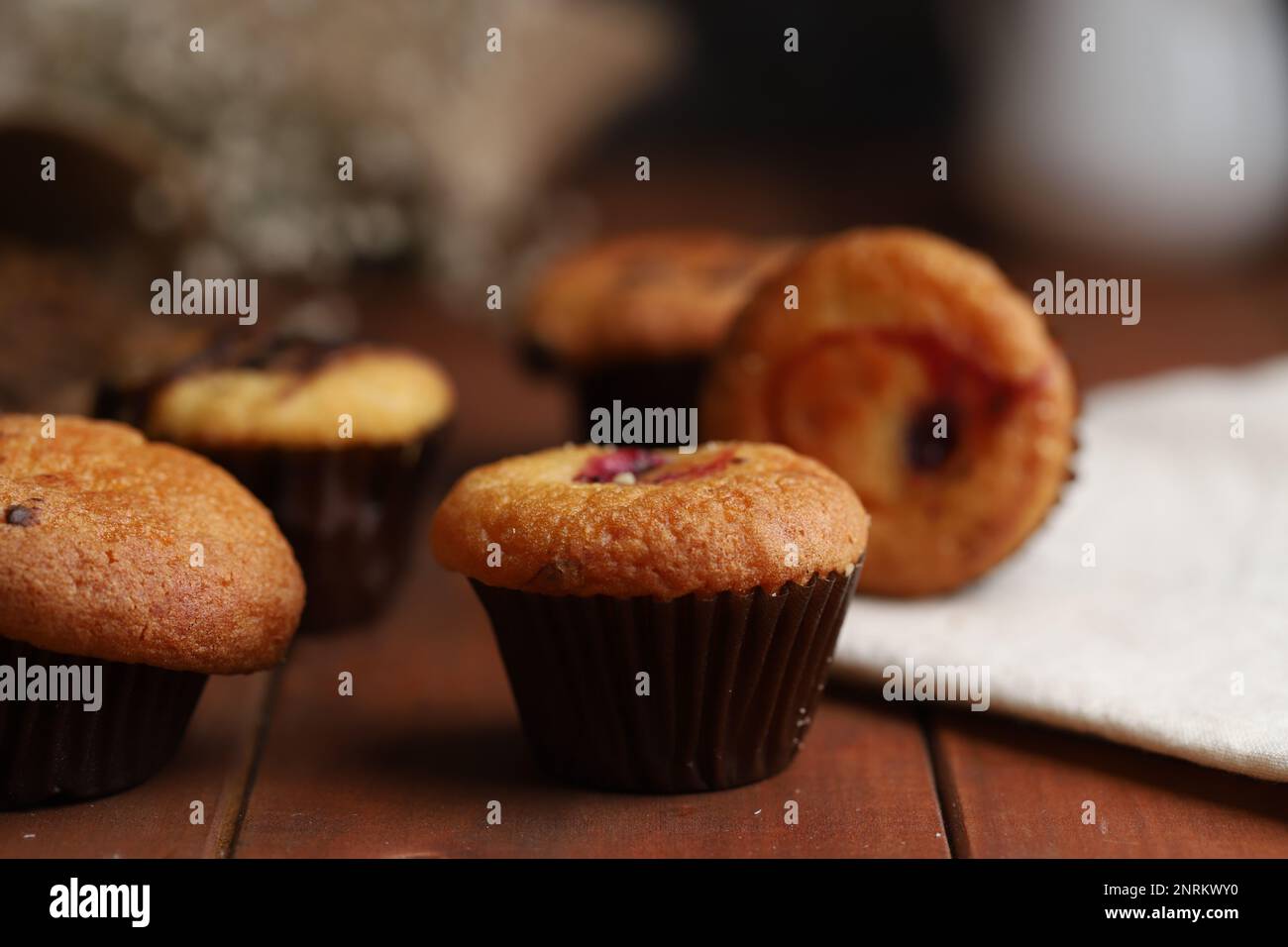 baked muffins over a wood table Stock Photo - Alamy