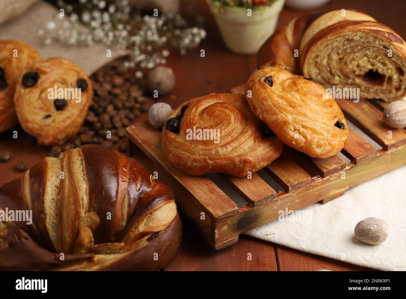 different types of bread baked fresh over wood texture Stock Photo - Alamy