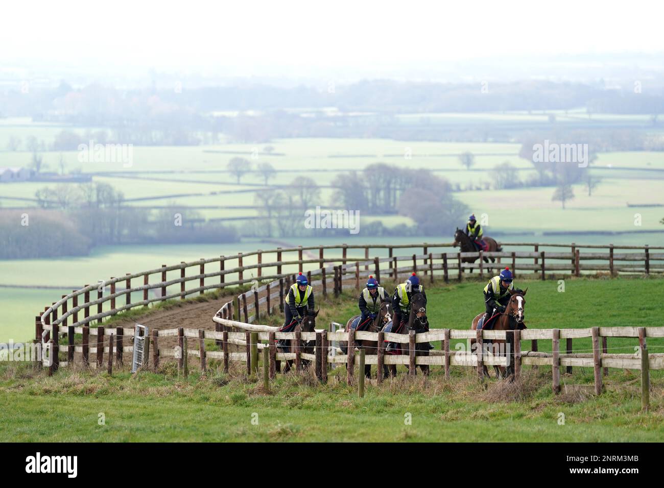 Horses and riders on the gallops during a visit to Manor Farm Stables ...
