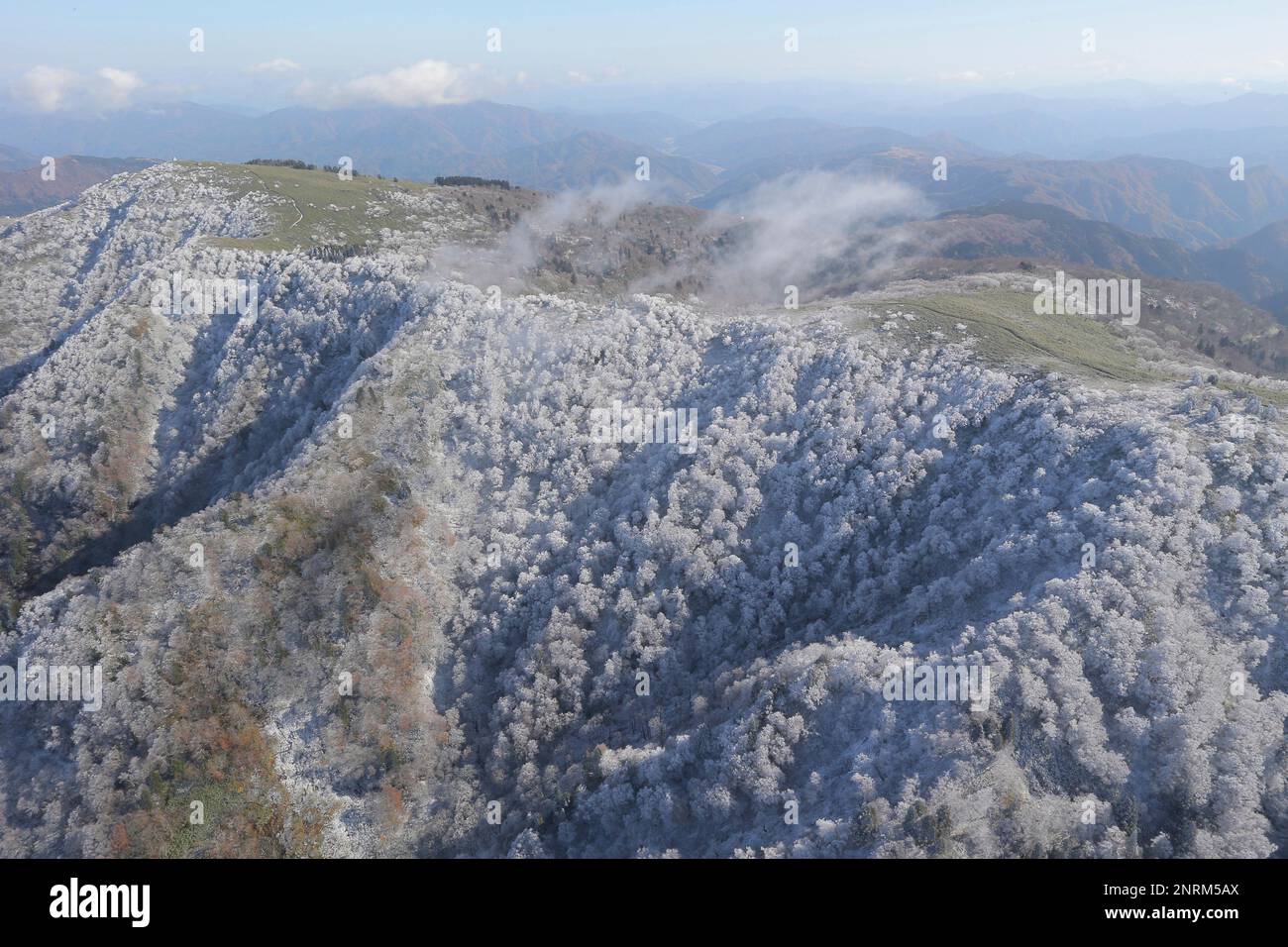 An aerial photo shows slightly snow covered Hyono Sen Mountain which ...