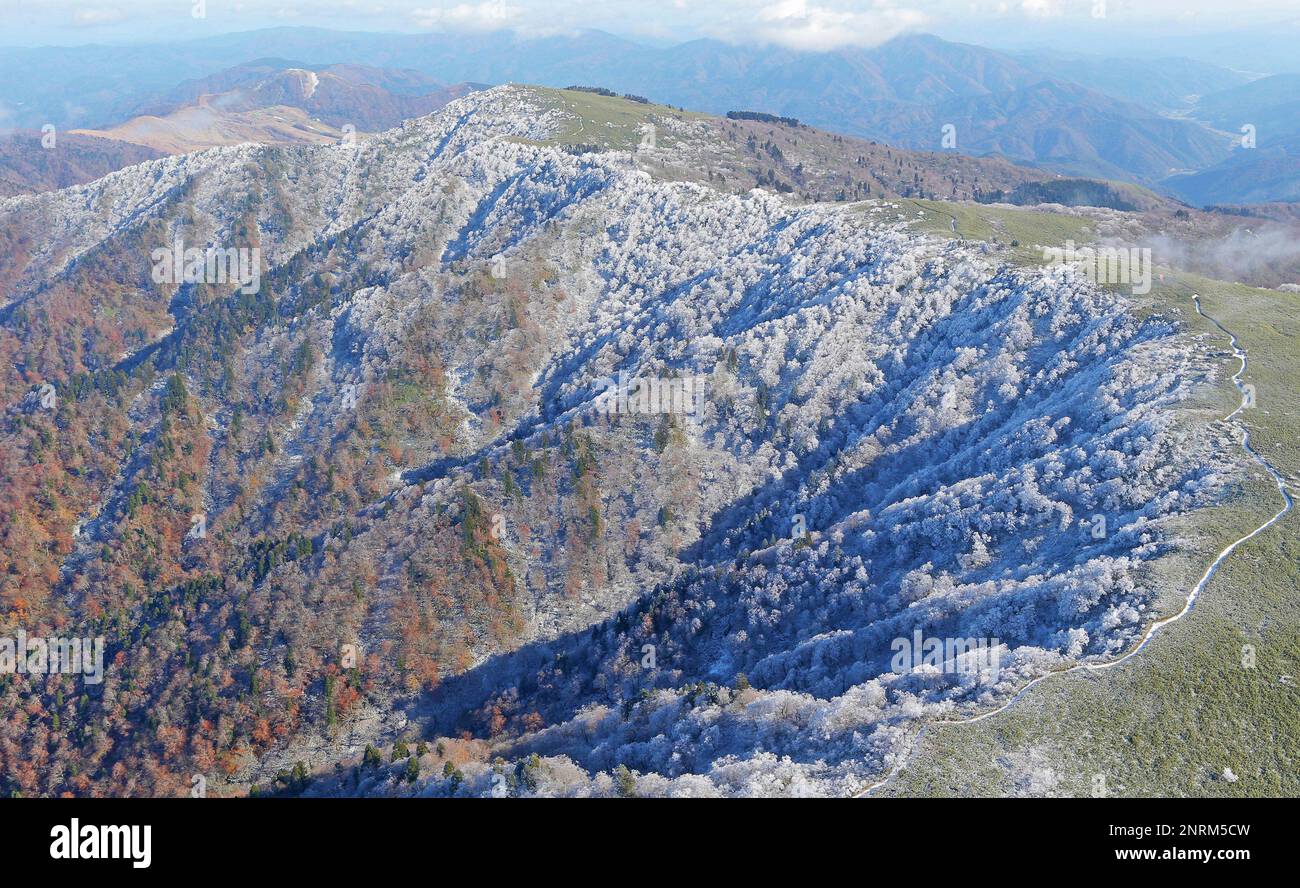 An aerial photo shows slightly snow covered Hyono Sen Mountain which ...