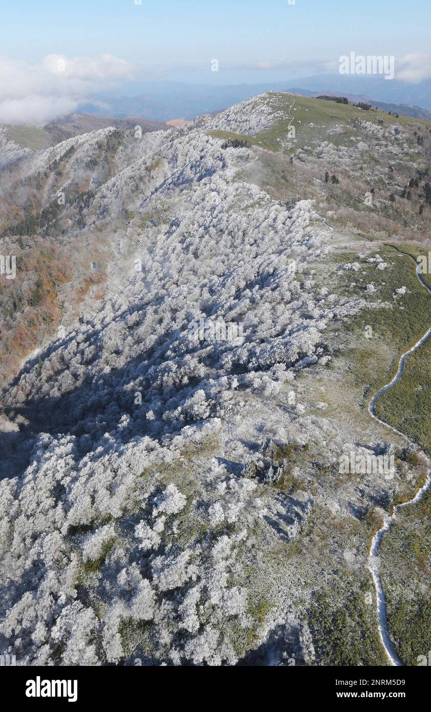An aerial photo shows slightly snow covered Hyono Sen Mountain which ...