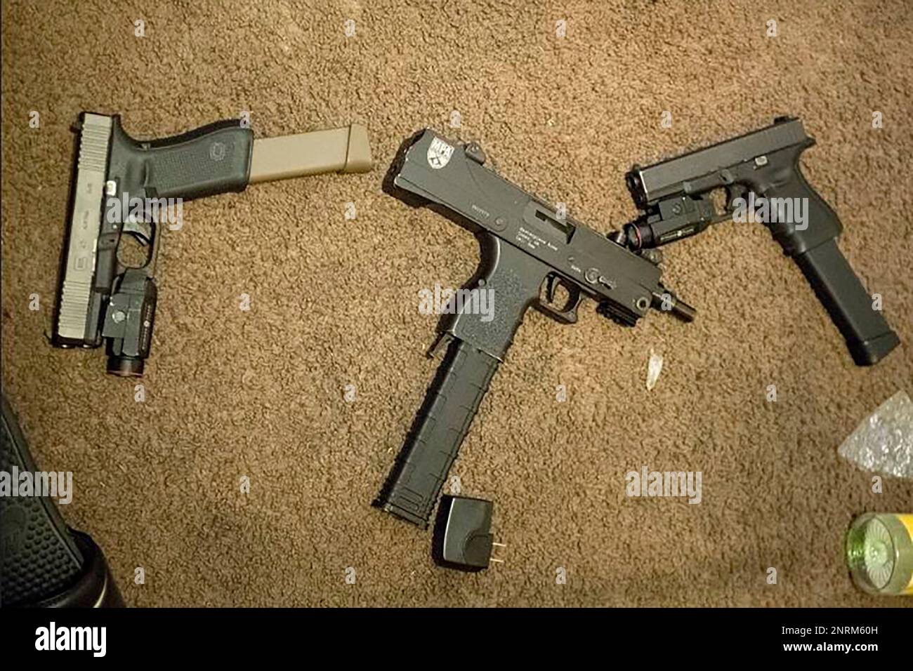 Weapons seized by law enforcement officers working in concert with the ...
