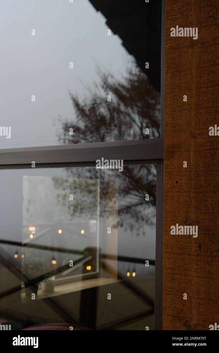 reflection of lights in a cabin window Stock Photo - Alamy