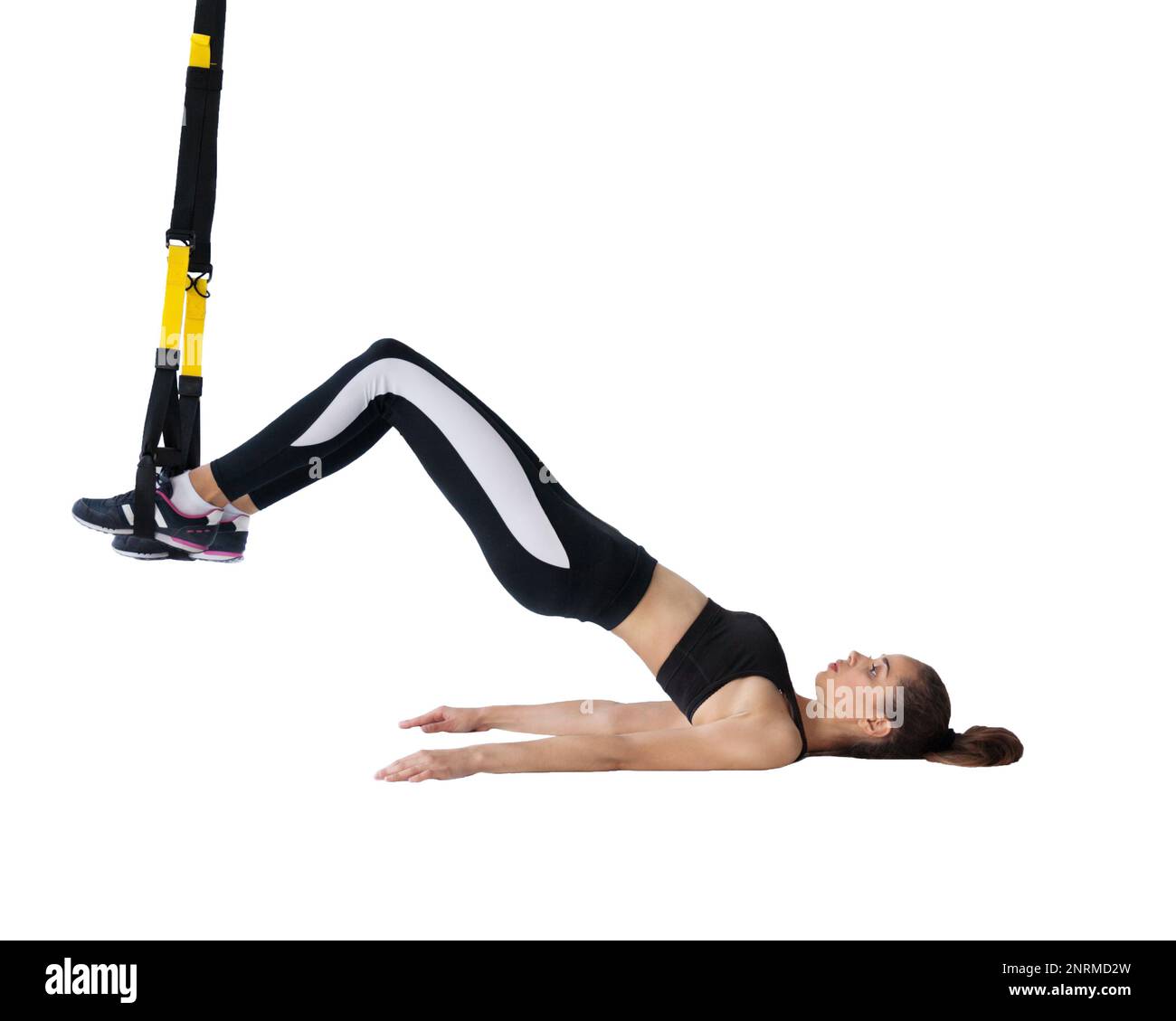 Fit pretty young woman doing fly yoga stretching exercises with trx fitness straps in fitness ...