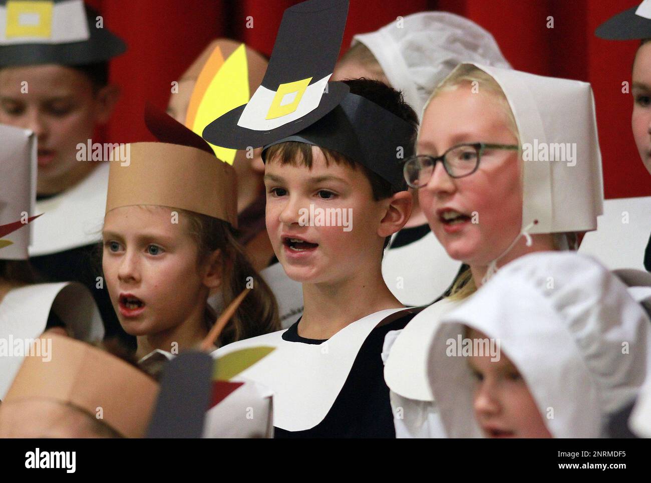 Callie Martin, Tyler Barker and Ava Thomas sing during a short program ...