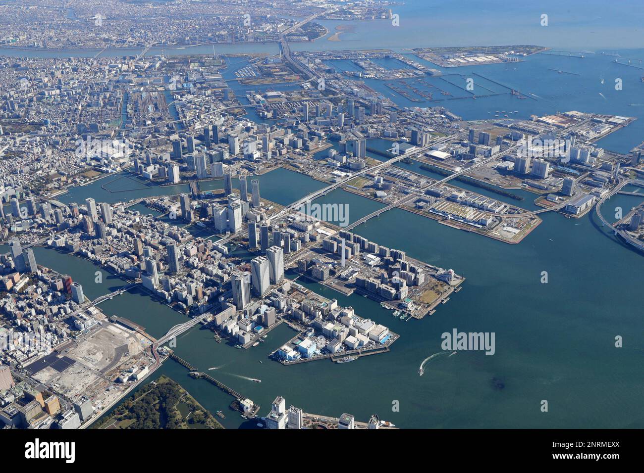 An aerial photo shows Athlete's Village (C) under construction in Chuo ...