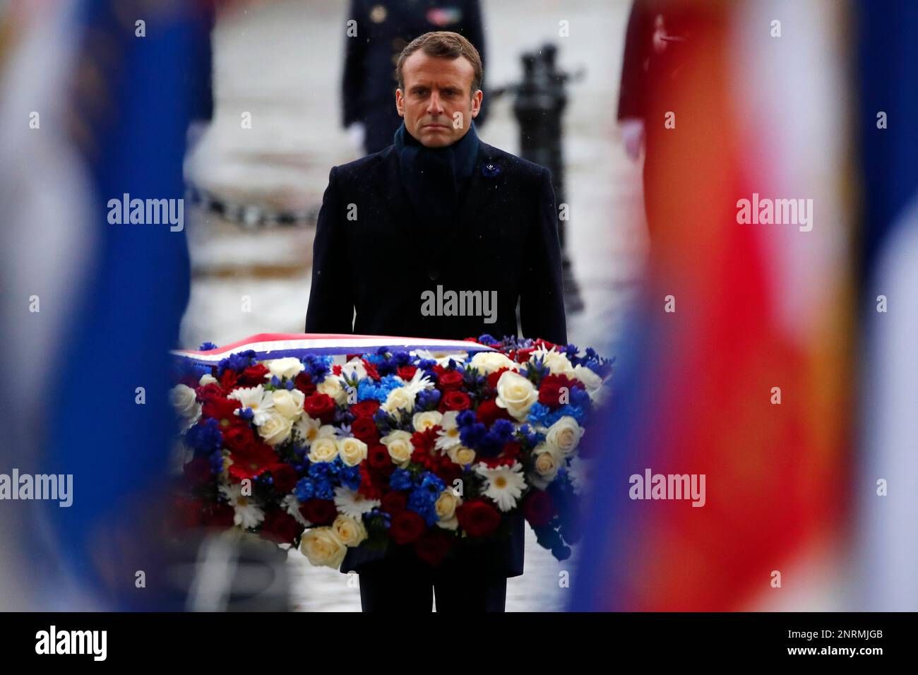 French President Emmanuel Macron lays a wreath of flowers at the Arc de ...