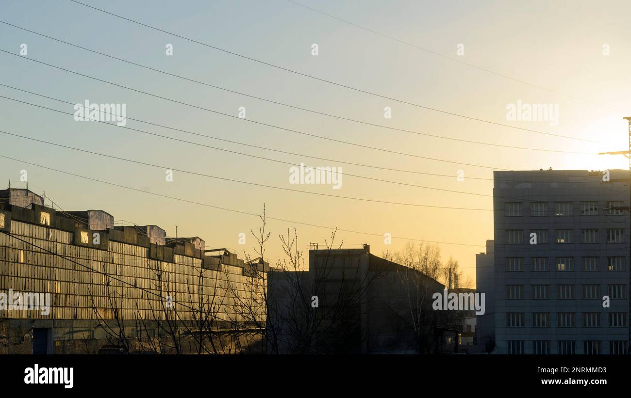Factory buildings and a coal-fired thermal power plant on the outskirts ...