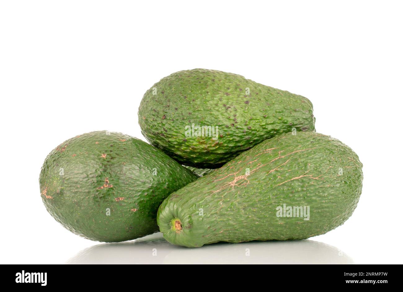 Three juicy avocados, macro, isolated on a white background Stock Photo ...