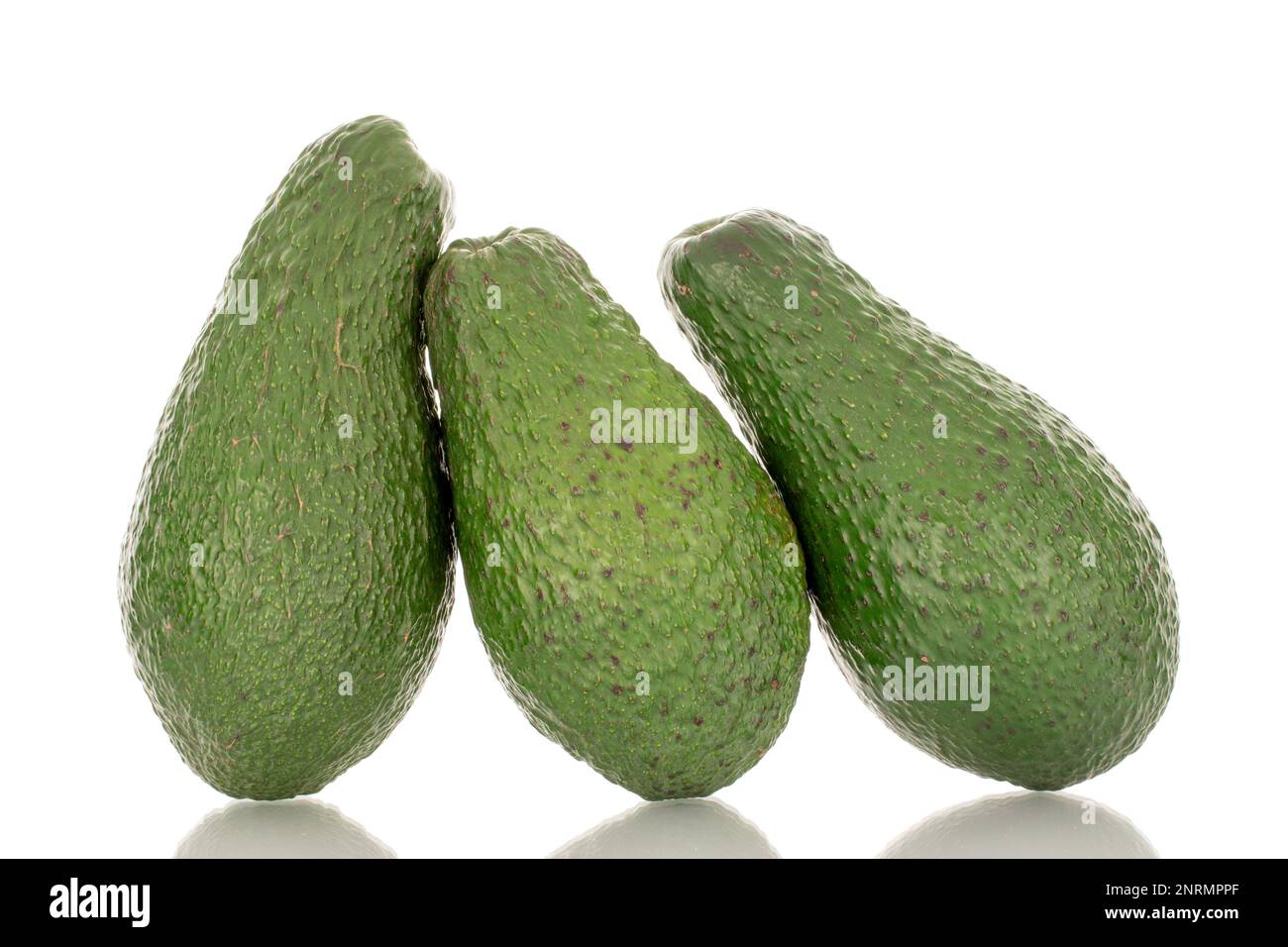 Three juicy avocados, macro, isolated on a white background Stock Photo ...