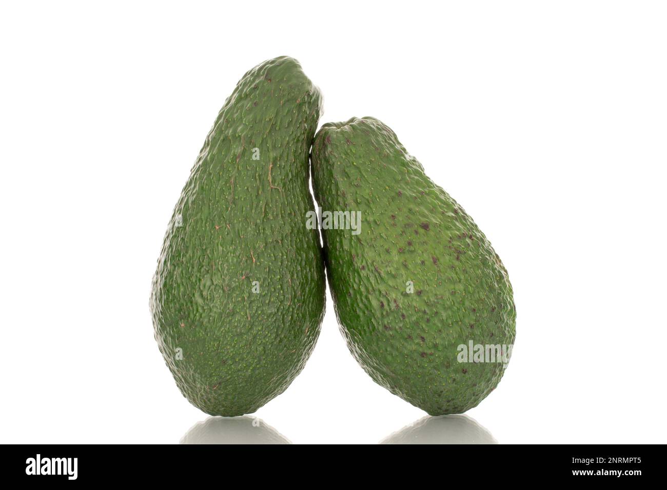Two juicy avocados, macro, isolated on a white background Stock Photo ...
