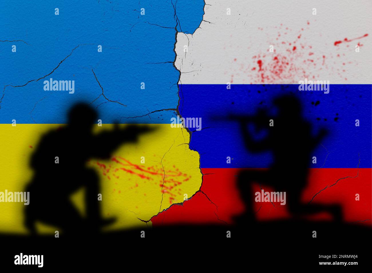 Ukraine and Russia flag divided by crack and silhouettes of fighting ...