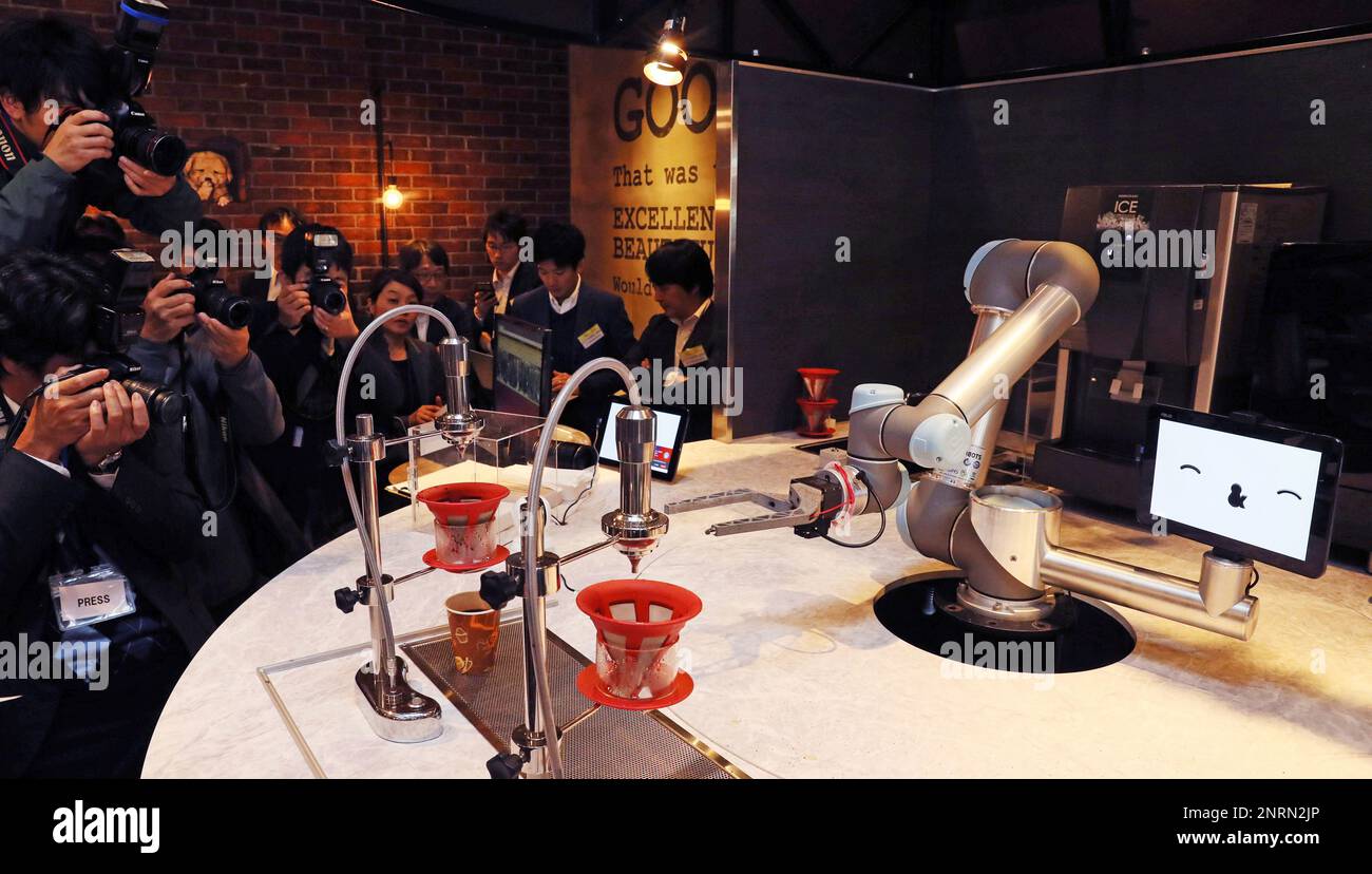 An arm-type robot which is equipped with AI communicates with customers ...