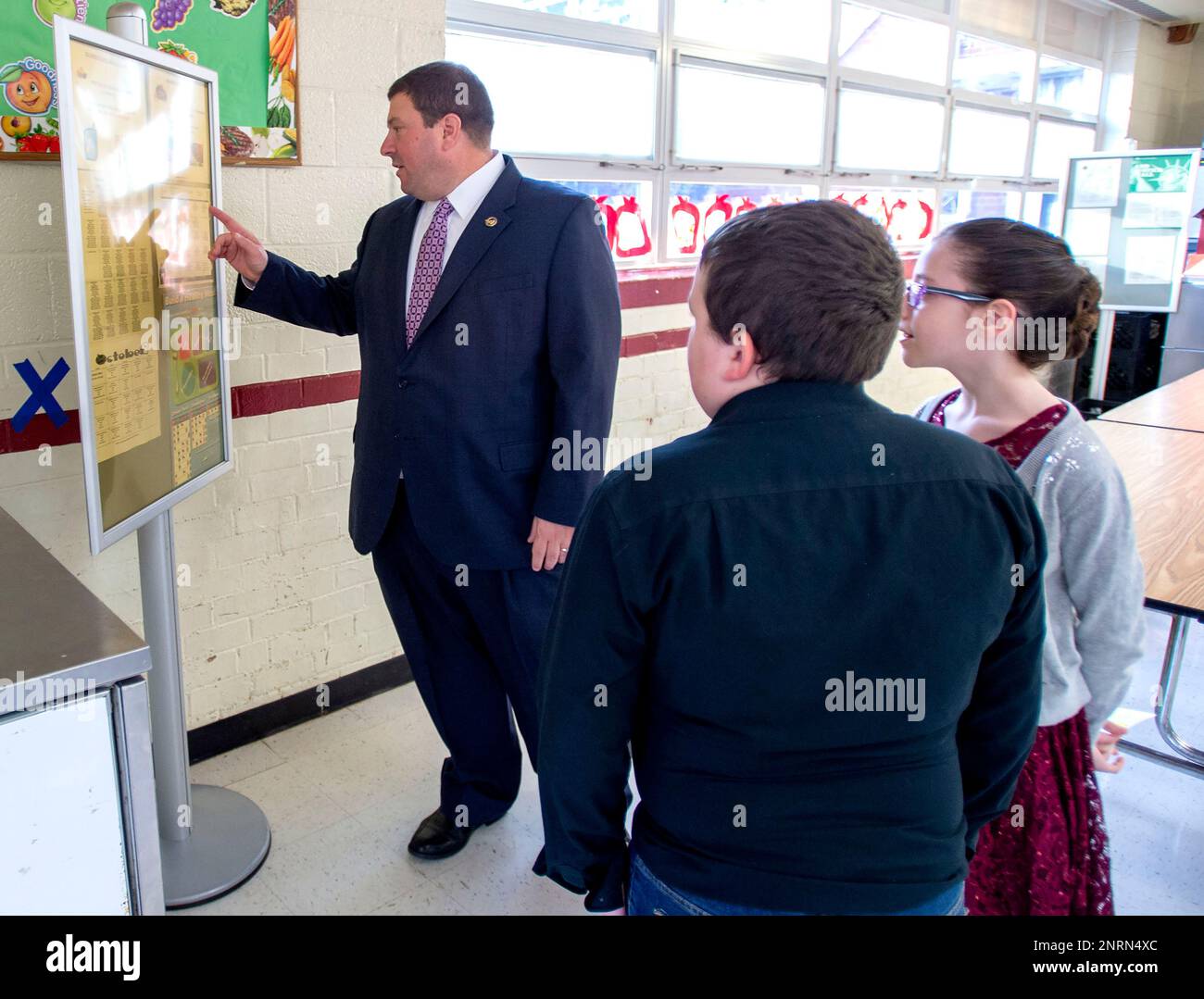 Virginia Superintendent of Public Instruction Dr. James Lane looks over ...