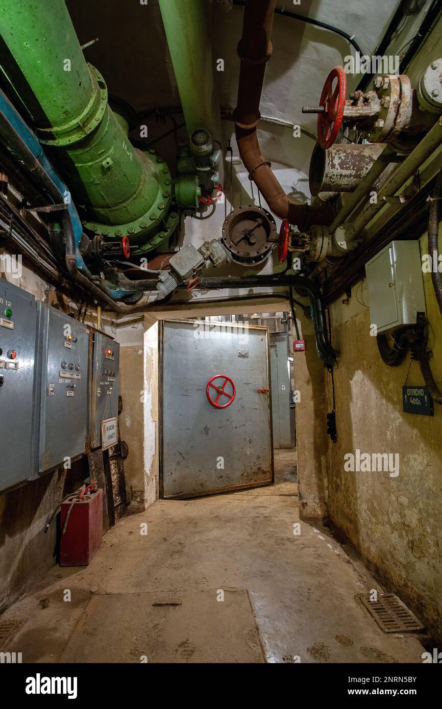 Hermetic rusty door of the bunker in underground abandoned tunnel ...