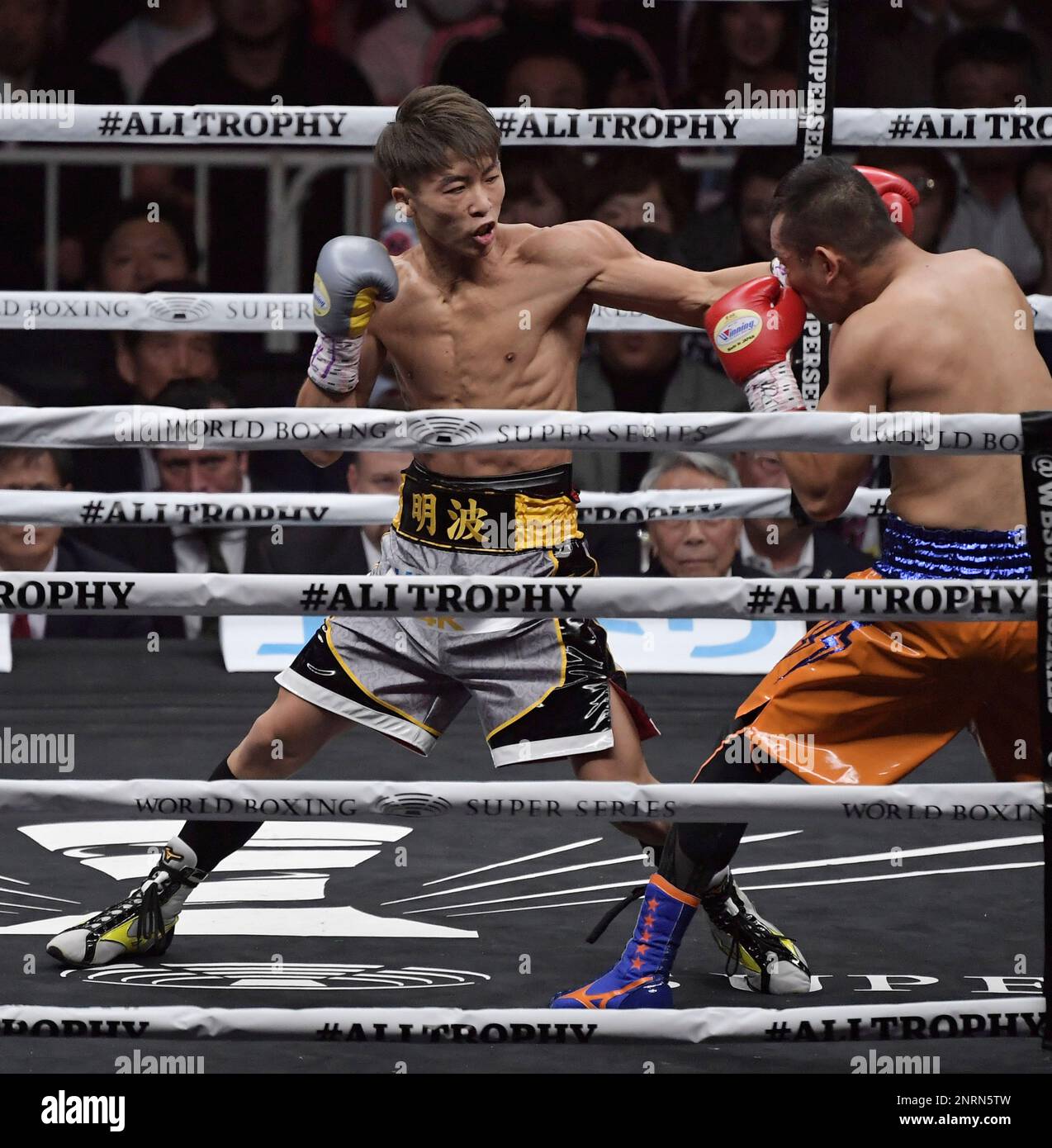 Naoya Inoue (L) of Japan throws a punch during the first round of World ...