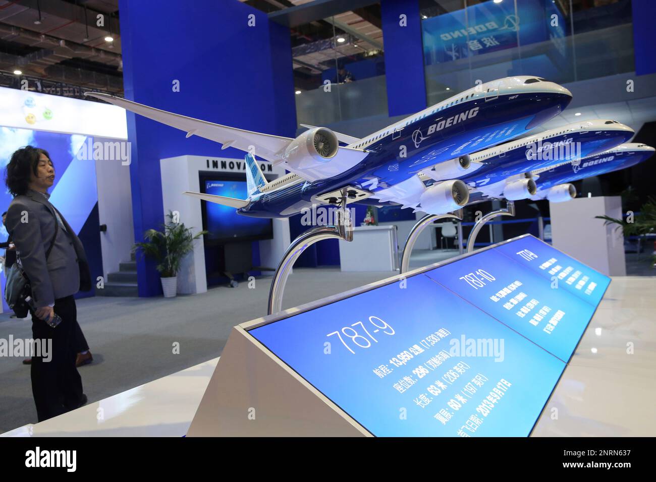 A visitor looks at the plane models in the Boeing booth at the 2nd ...