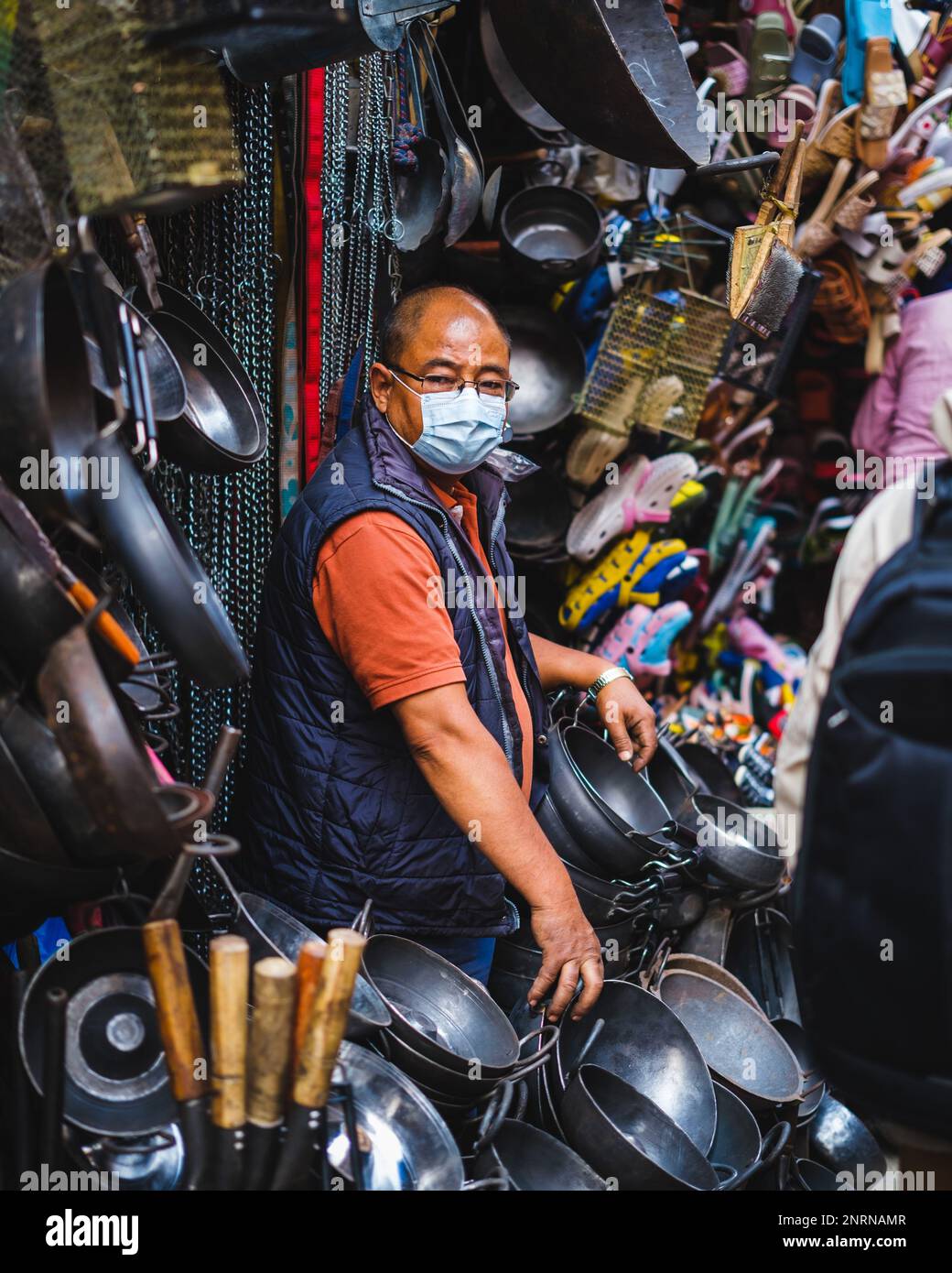 Kathmandu, Nepal, 04 23 2022: A man selling pots on Kathmandu bazaar ...