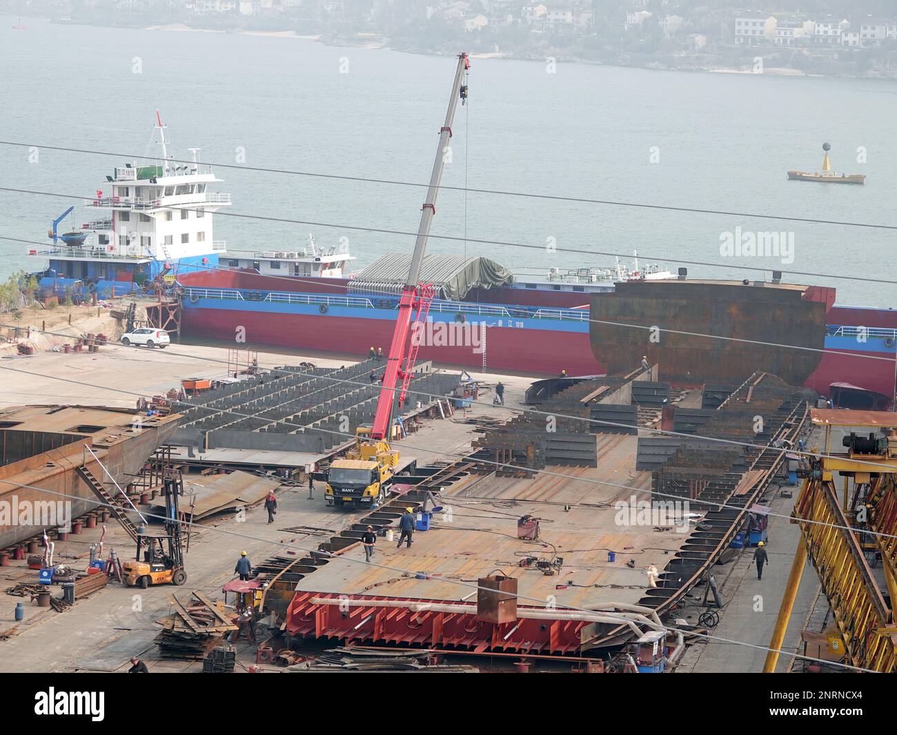 YICHANG, CHINA - FEBRUARY 27, 2023 - Shipyard workers build ships in ...