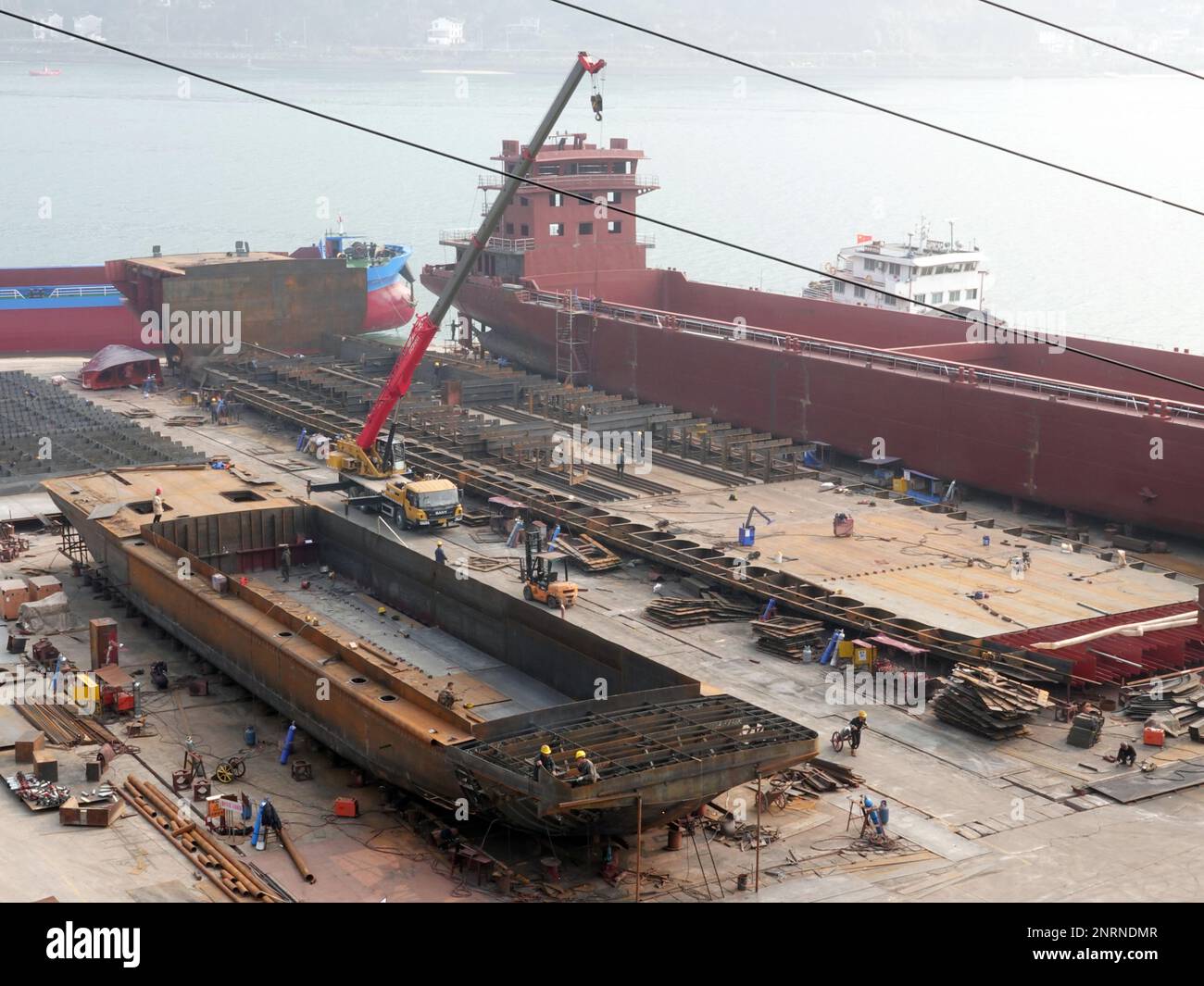 YICHANG, CHINA - FEBRUARY 27, 2023 - Shipyard workers build ships in ...