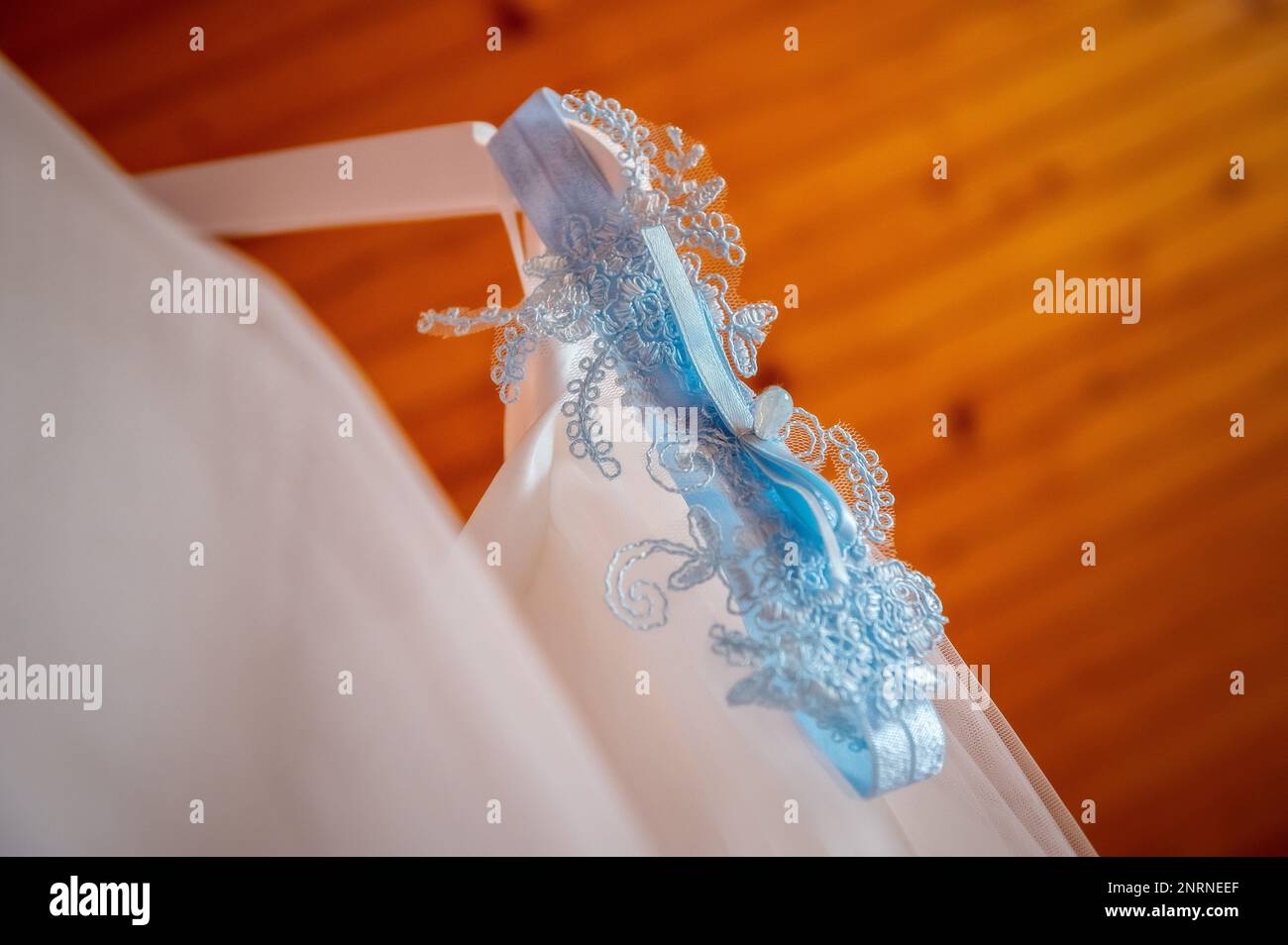 bride and groom's wardrobe and items of clothing blue bridal garter on ...